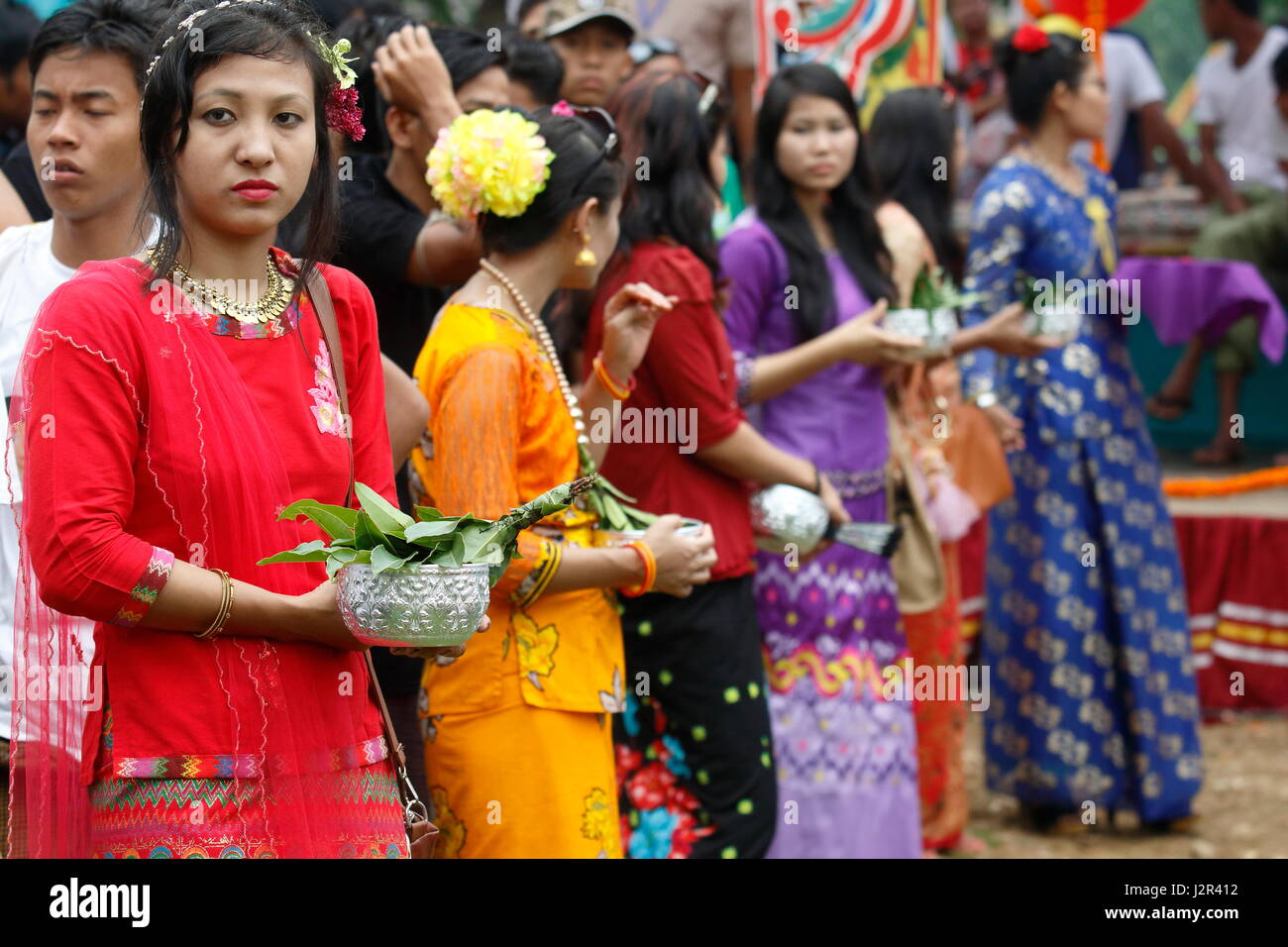 Marma girls prepare water festival on occasion of Baisabi festival. It ...