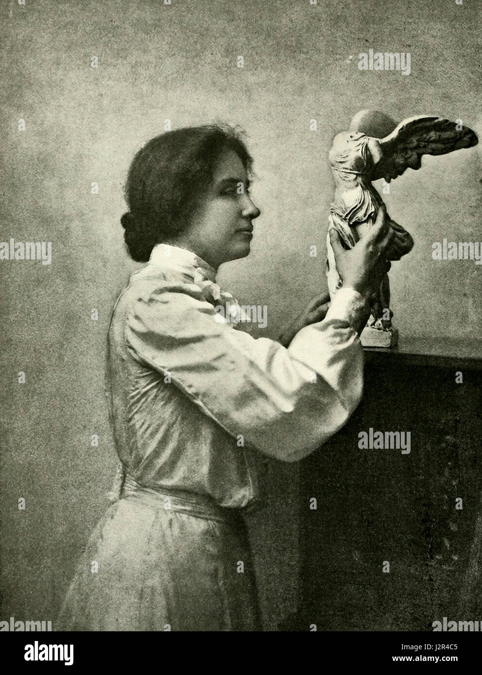 Helen Keller exercising the sense of touch, circa 1905 Stock Photo - Alamy
