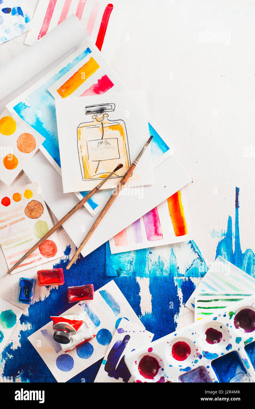 Creative artist workplace with watercolor and sketches Stock Photo - Alamy