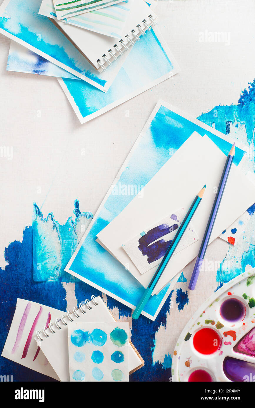 Creative artist workplace with watercolor and sketches Stock Photo - Alamy