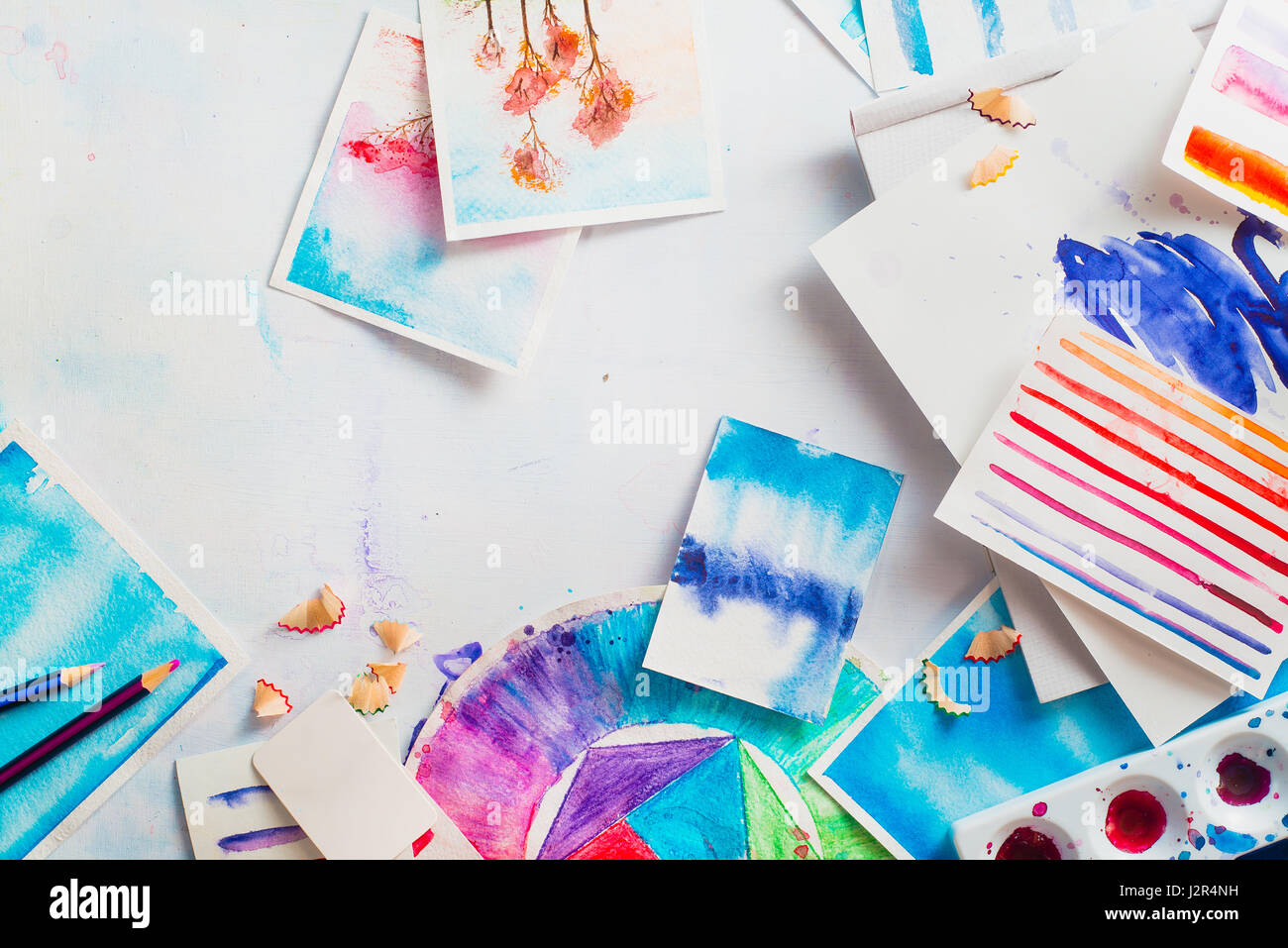 Creative artist workplace with watercolor and sketches Stock Photo - Alamy