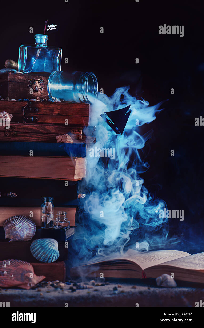 Dark marine still life with an open book and a boat silhouette in a ...