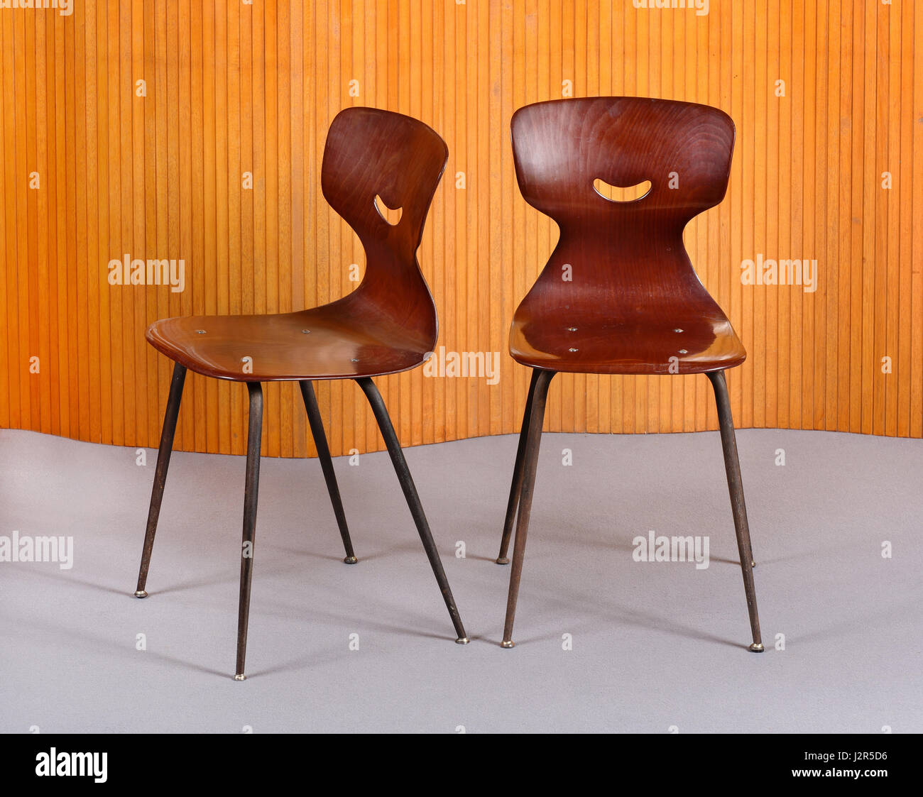 Stylish bentwood designer chairs with curved backs and metal legs ...