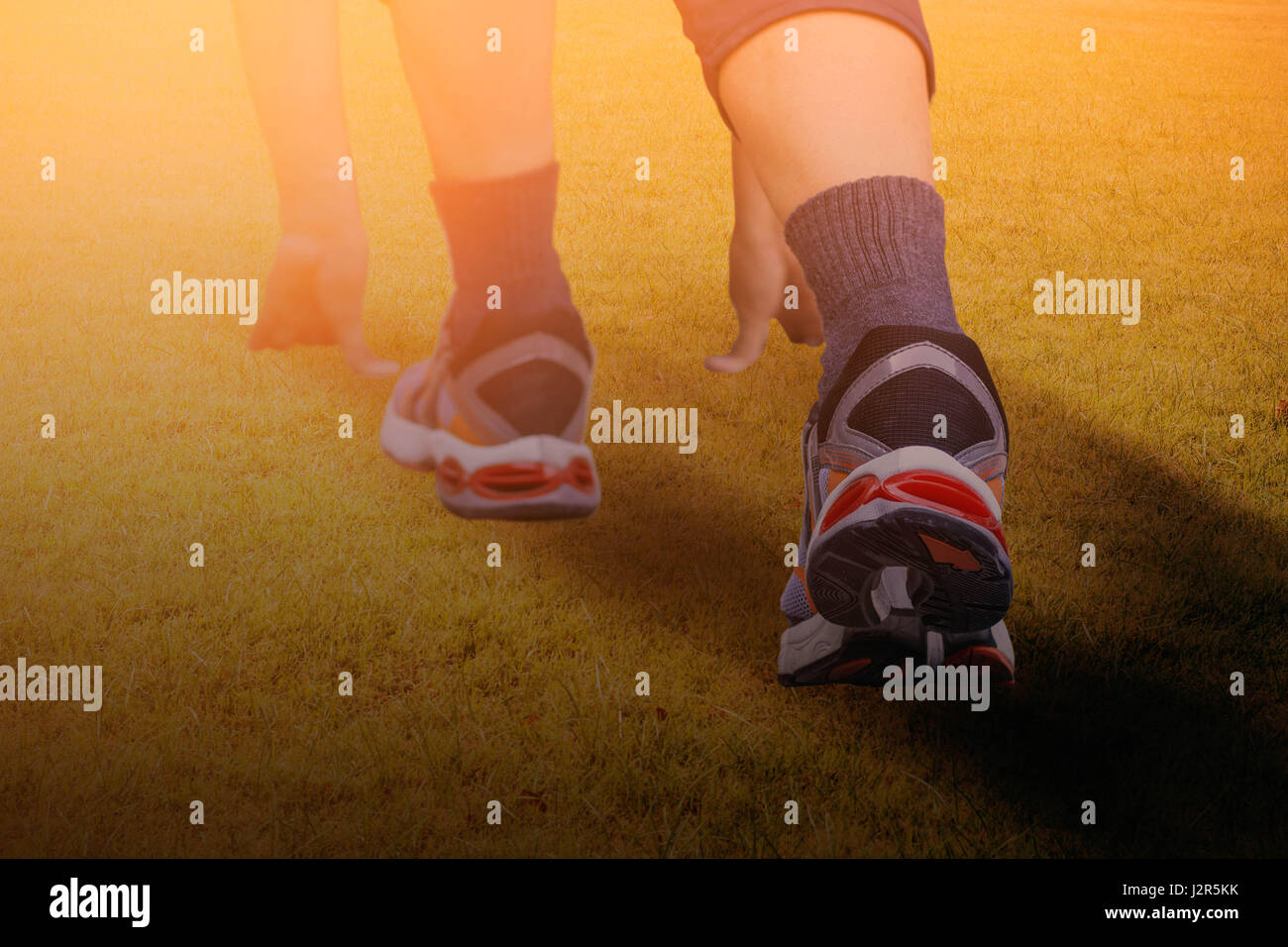 People are ready to run on the turf Stock Photo - Alamy