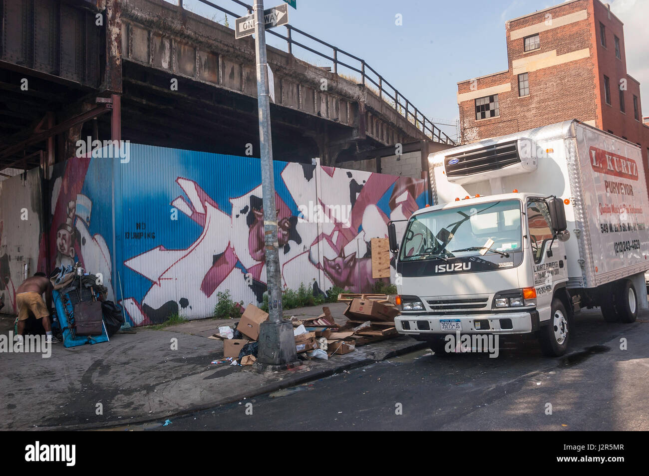 New York, NY 26 August 2004 - Man rummaging through garbage in the ...