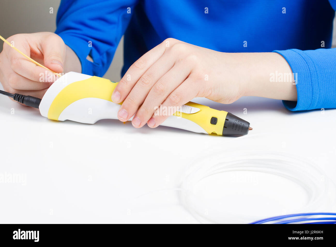 Kids hand with 3d printing pen Stock Photo - Alamy