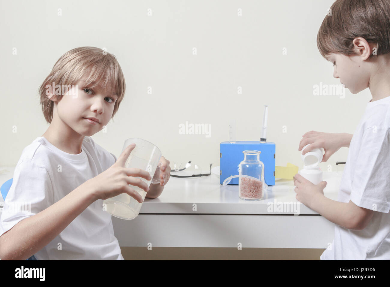 Boys making science experiments. Education concept Stock Photo - Alamy