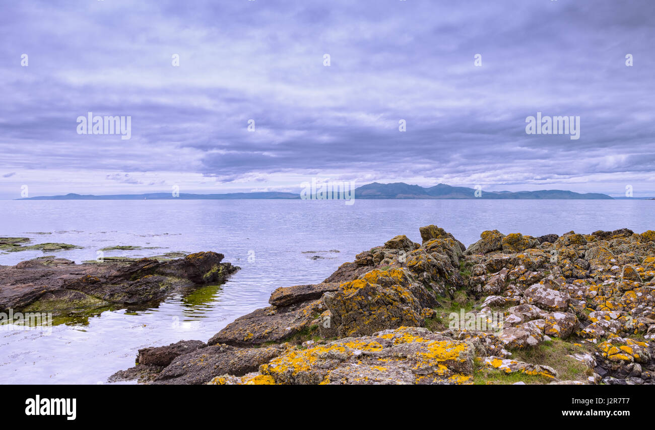 A course Scottish Beach of Rocks and the River clyde with Arran Hills ...