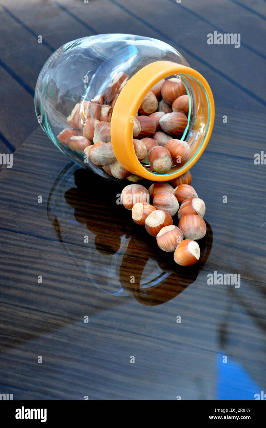 Glass jar with hazelnuts Stock Photo - Alamy