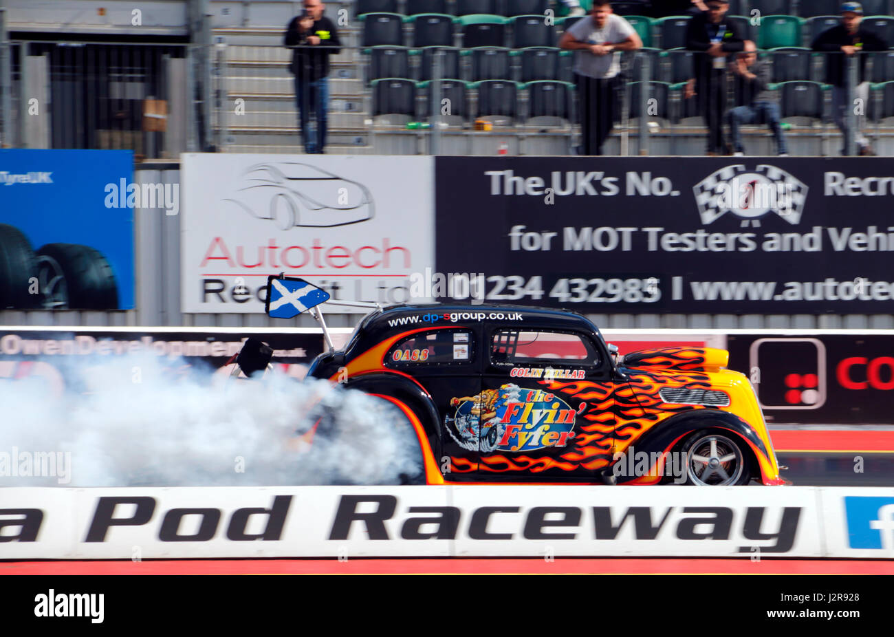 A hot rod does a burn out at the Santa Pod raceway in England Stock ...