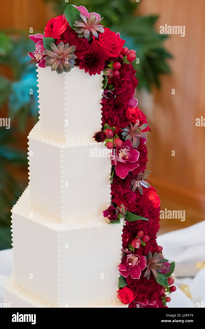 Tower Wedding Cake with Red Flowers Stock Photo - Alamy