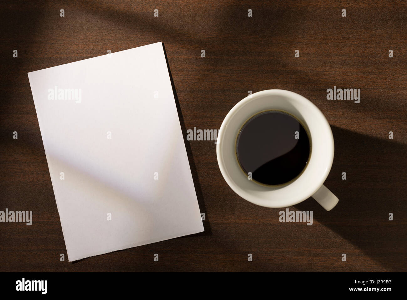 Blank paper note and coffee on the table Stock Photo - Alamy