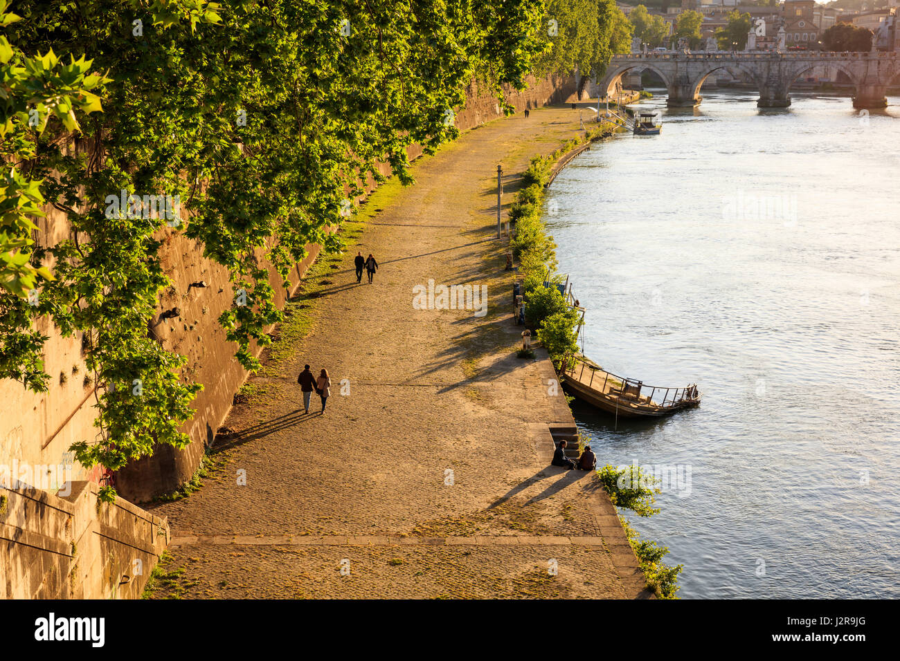 Couples walking by the Tiber river in Rome, Italy Stock Photo - Alamy