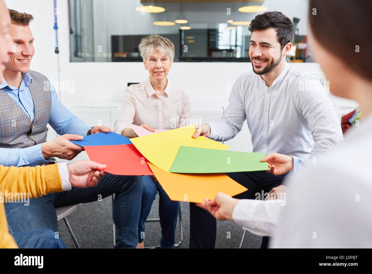 Creative business startup team makes exercise for teambuilding Stock ...