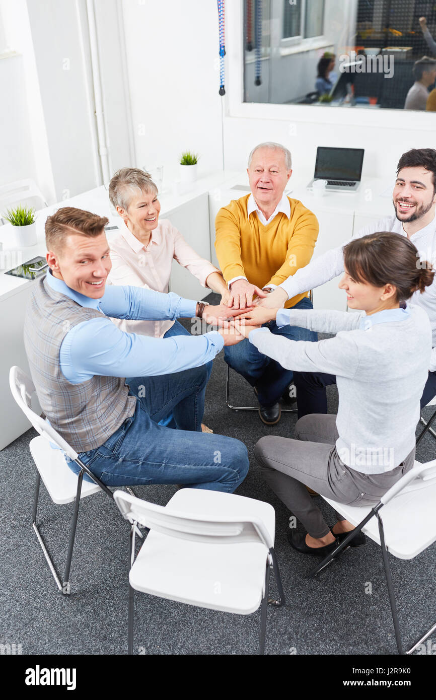 Business team makes teambuilding exercise in seminar Stock Photo - Alamy