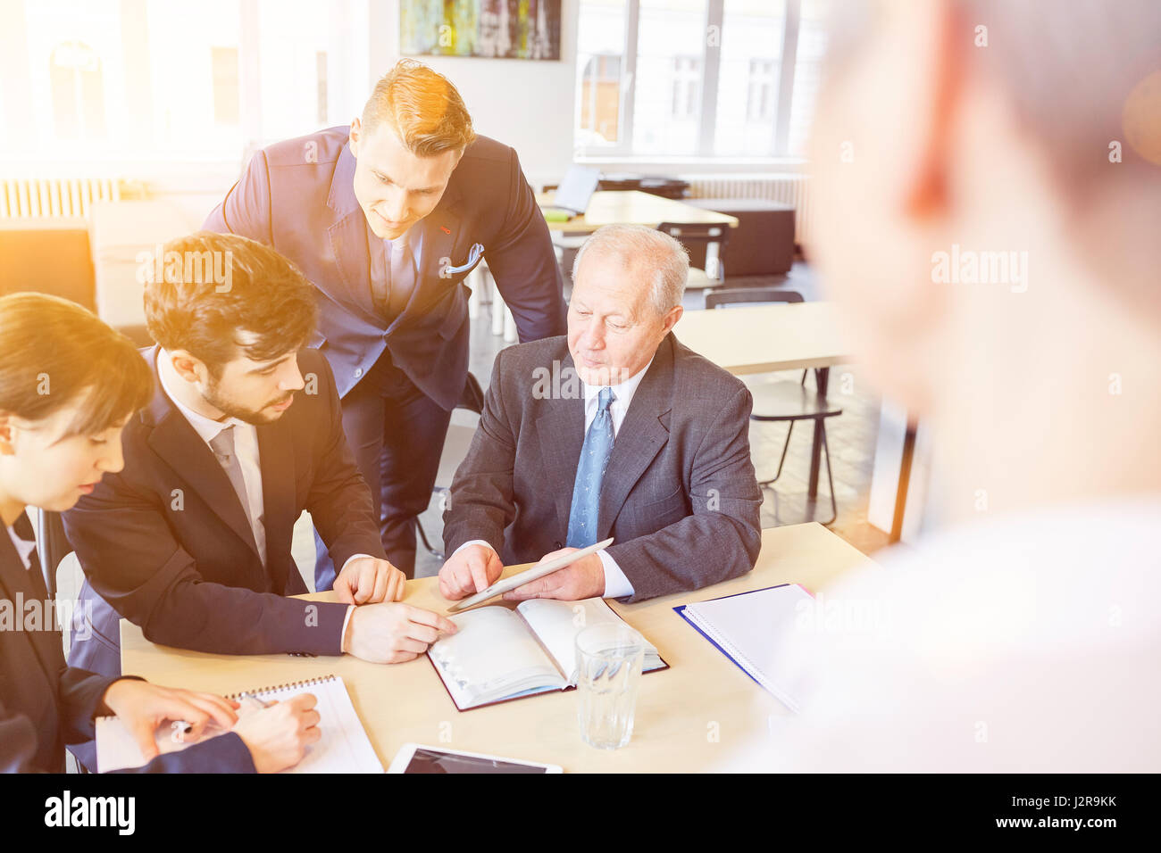 Business team meeting for planning in office with tablet and calendar ...