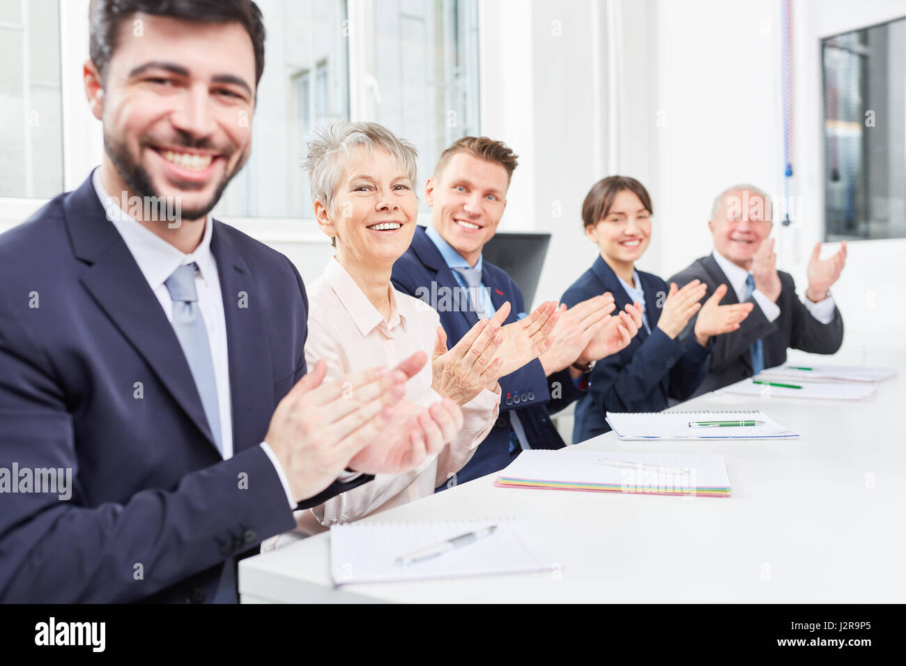Business team clap in seminar after successful workshop Stock Photo - Alamy
