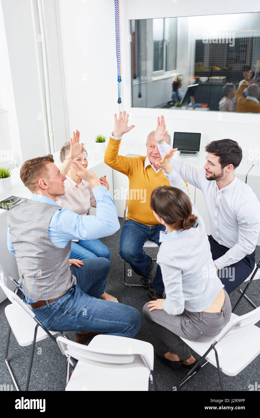 Motivation exercise for group of business people in teambuilding ...