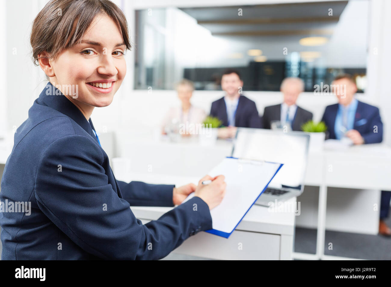 Woman as seminar speaker giving business lecture Stock Photo - Alamy