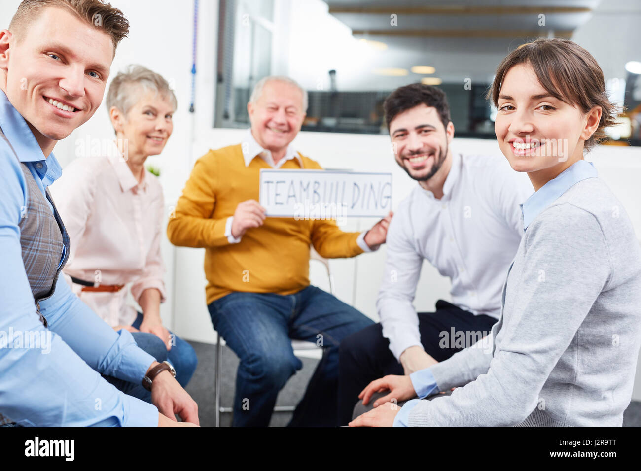 Successful business group at team building workshop Stock Photo - Alamy
