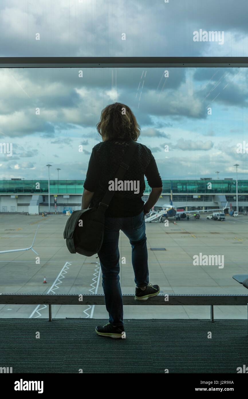 Passenger waiting in departure lounge for delayed flight Stock Photo ...