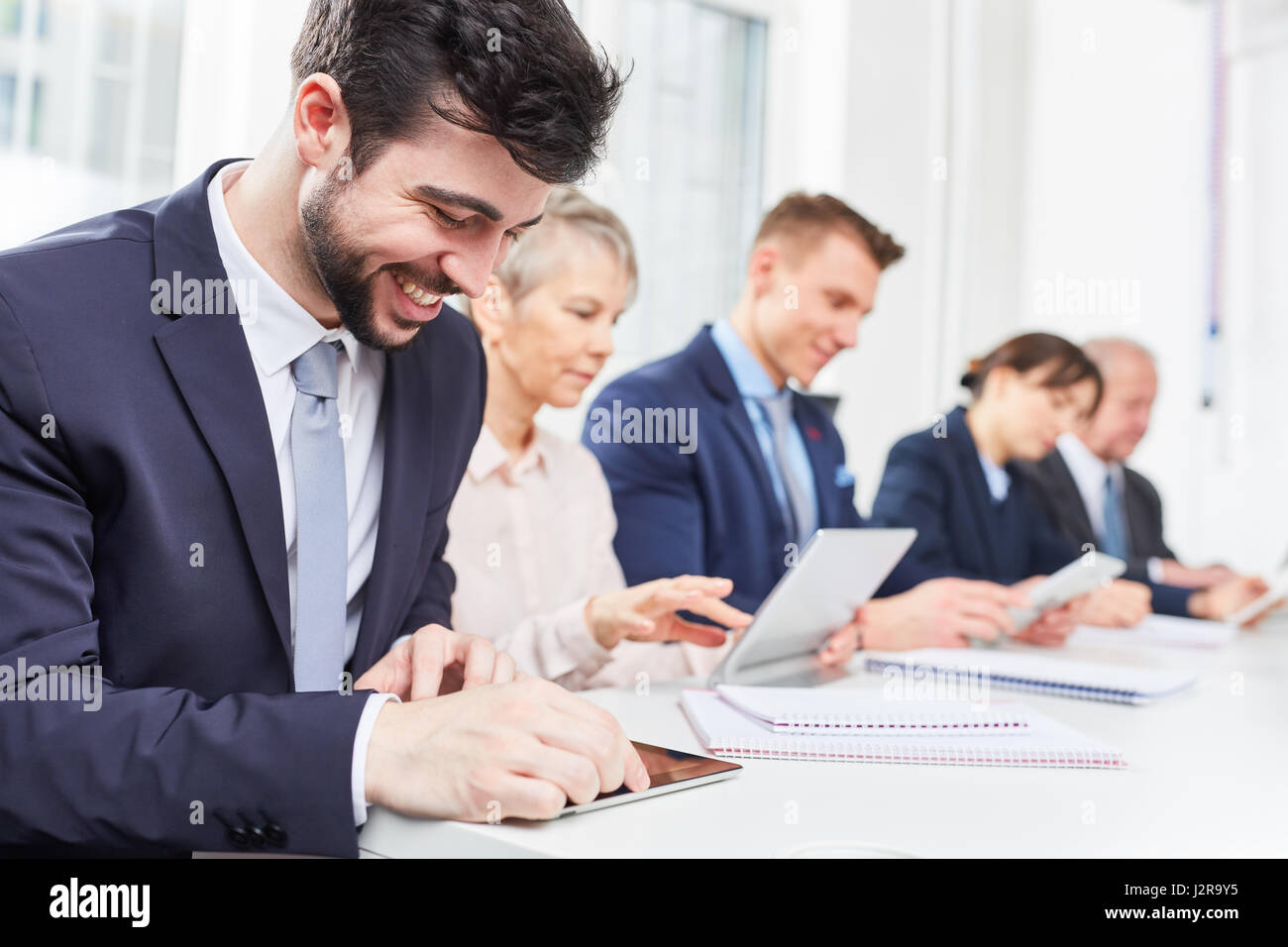 Business man in seminar with group working in cooperation as team Stock ...
