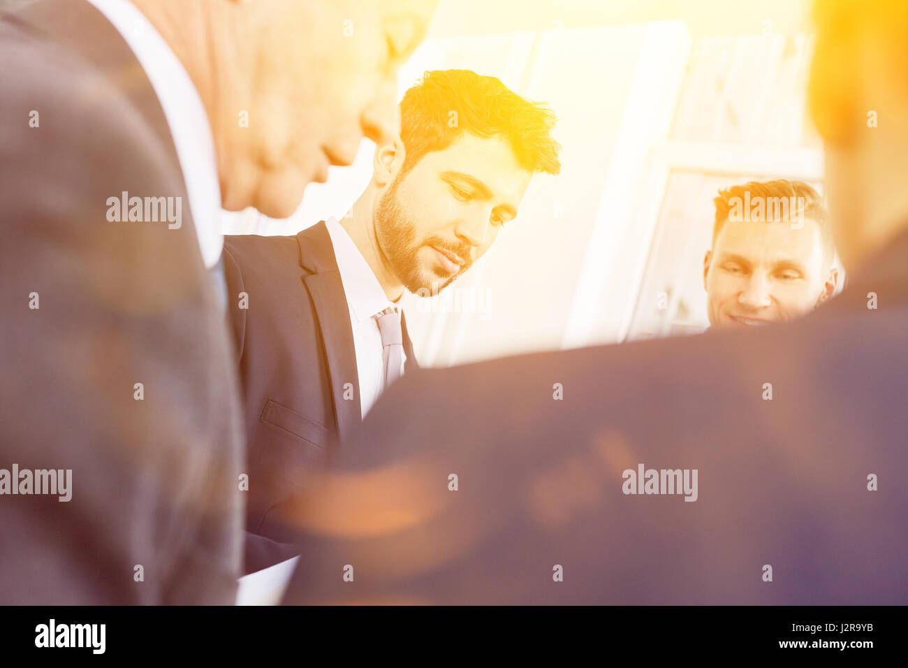 Group of business people talk together in team meeting Stock Photo - Alamy