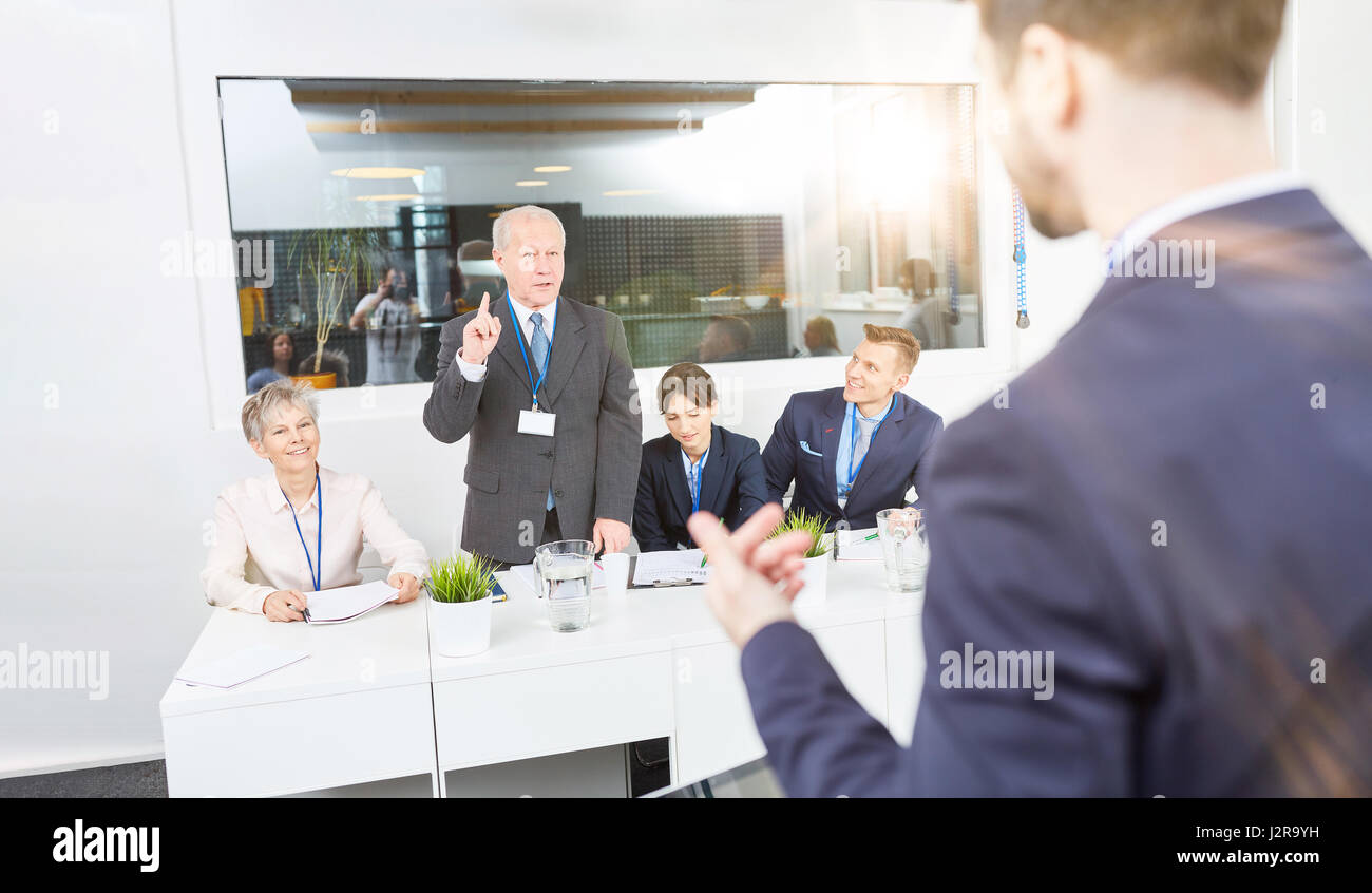 Man in business presentation gives lecture in conference room Stock ...