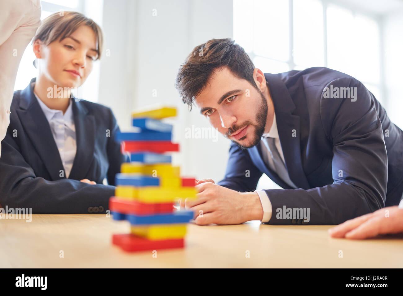 Business man build blocks hi-res stock photography and images - Alamy