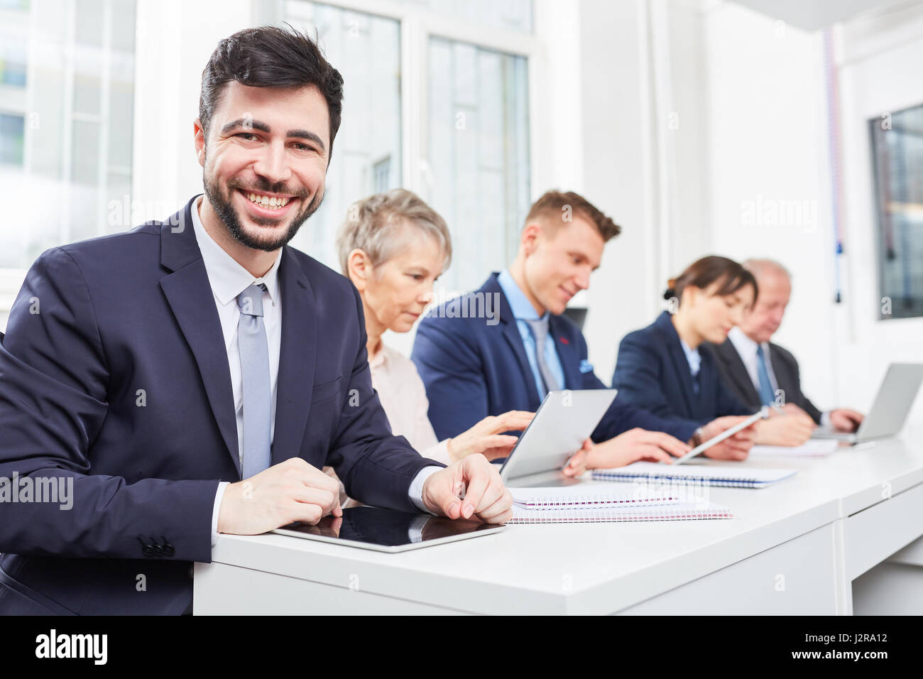 Man as entrepreneur businessman founder with start-up team Stock Photo ...