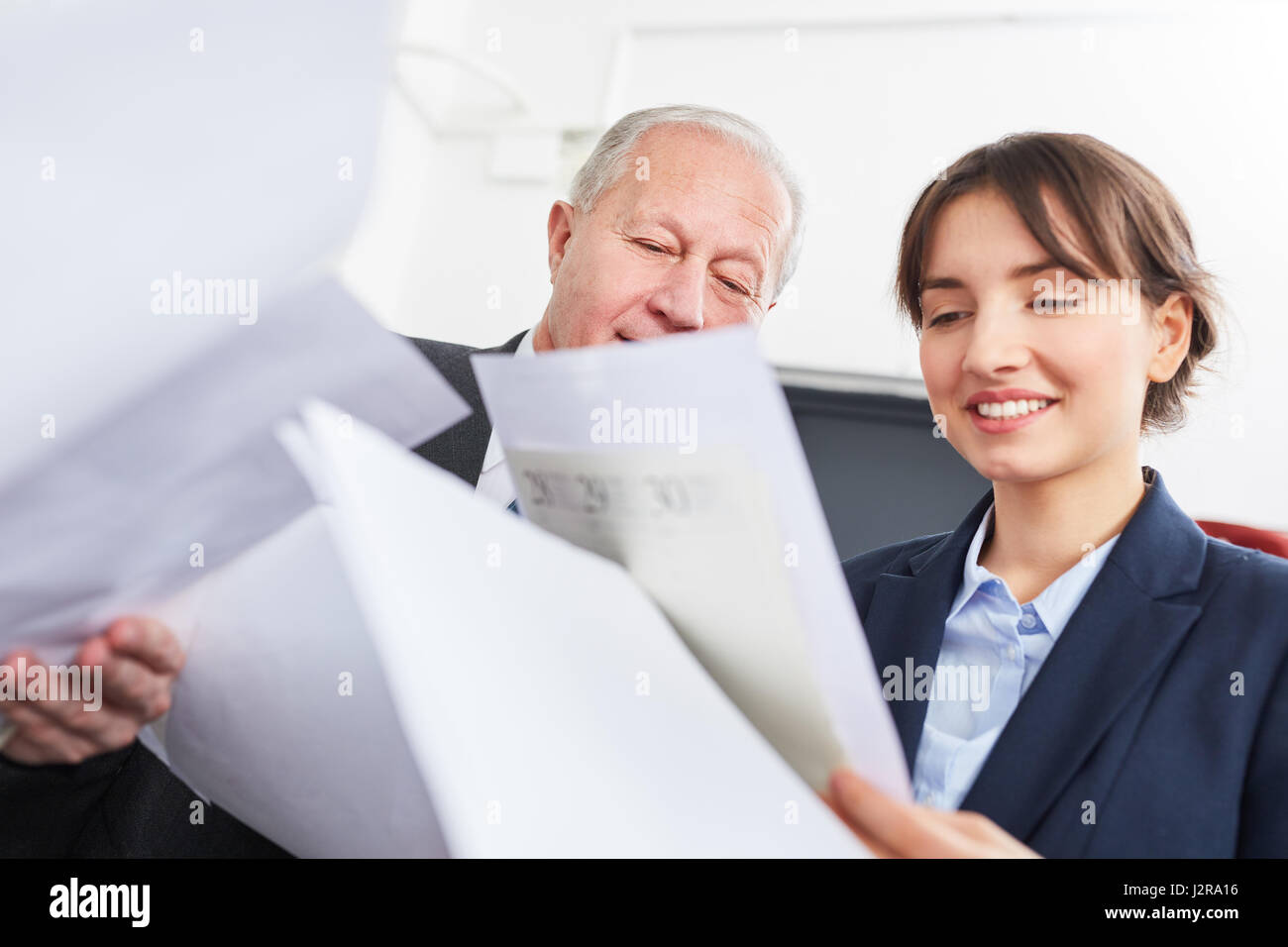 Business woman and senior check and analyze document in teamwork Stock ...
