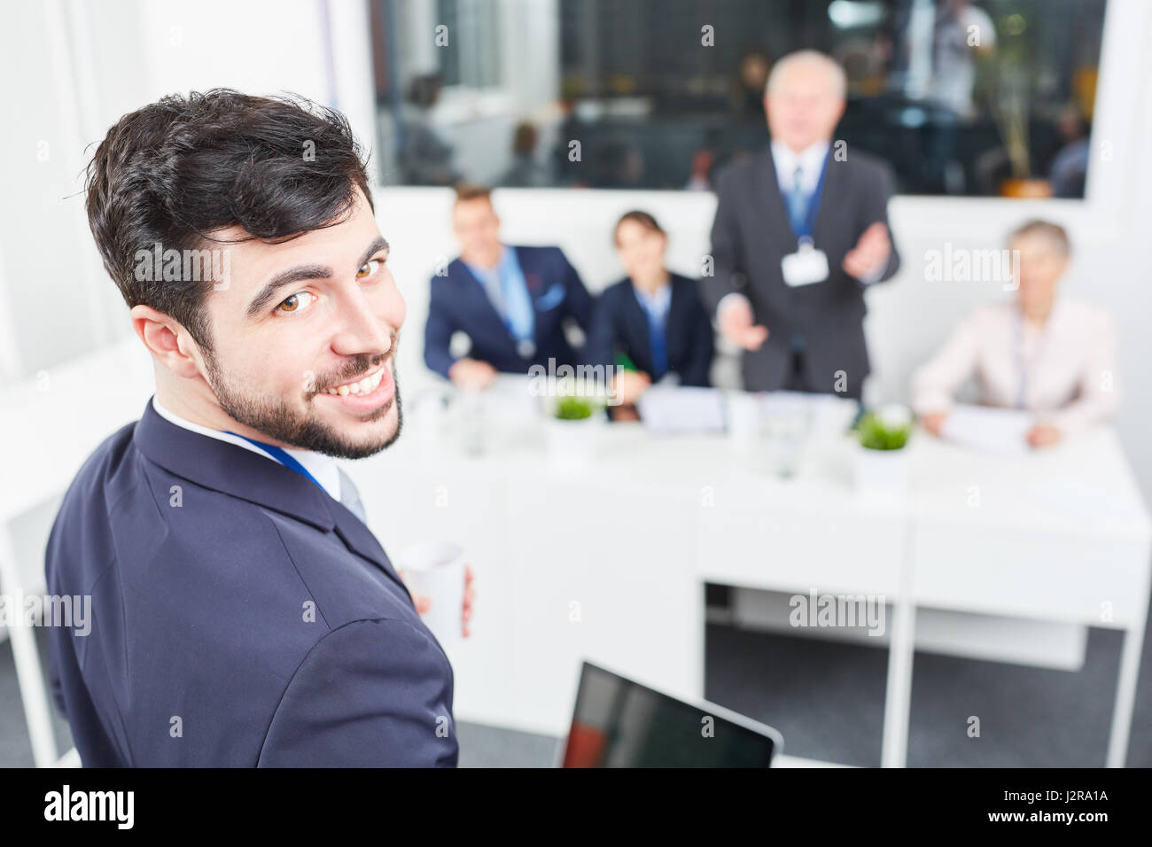 Man as speaker and consultant in consulting workshop Stock Photo - Alamy