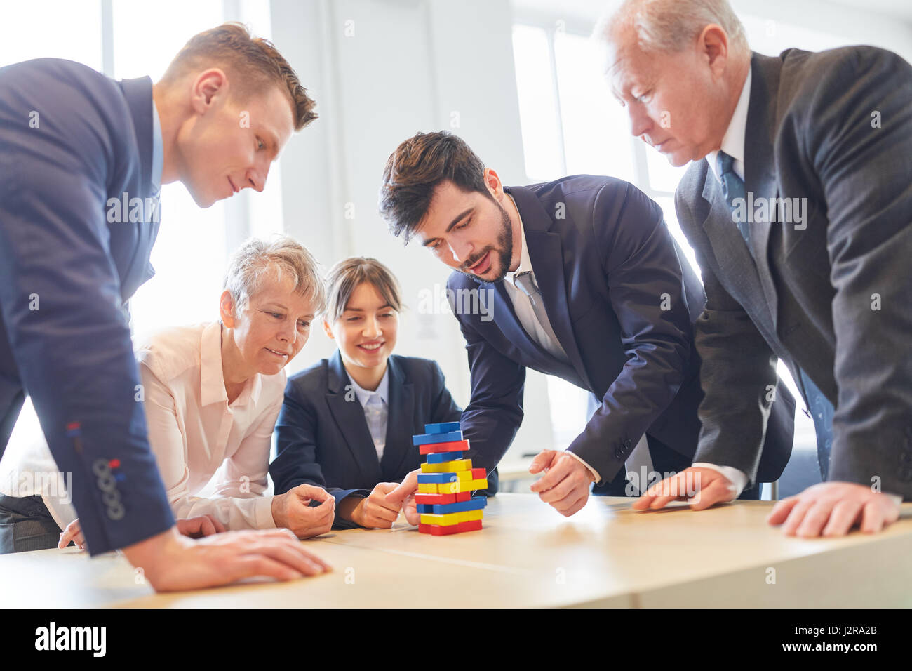 Teambuilding creative workshop building blocks in teamwork Stock Photo ...