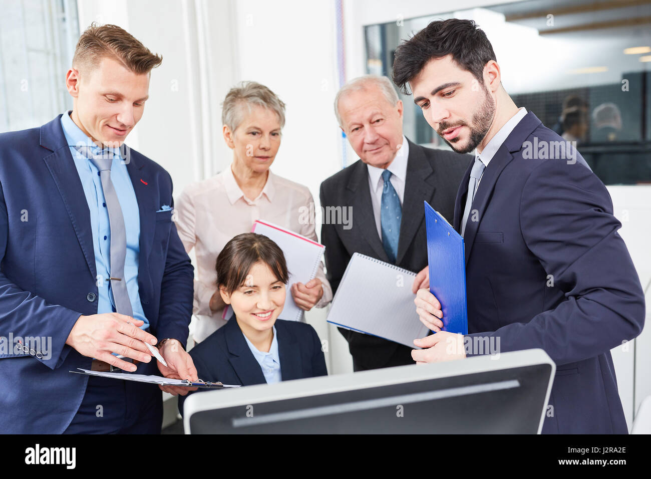 Group of business people training their computer skills Stock Photo - Alamy