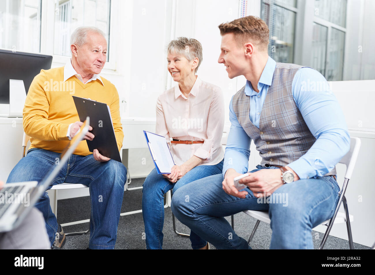 Business people in team discussion debate of new strategy Stock Photo ...