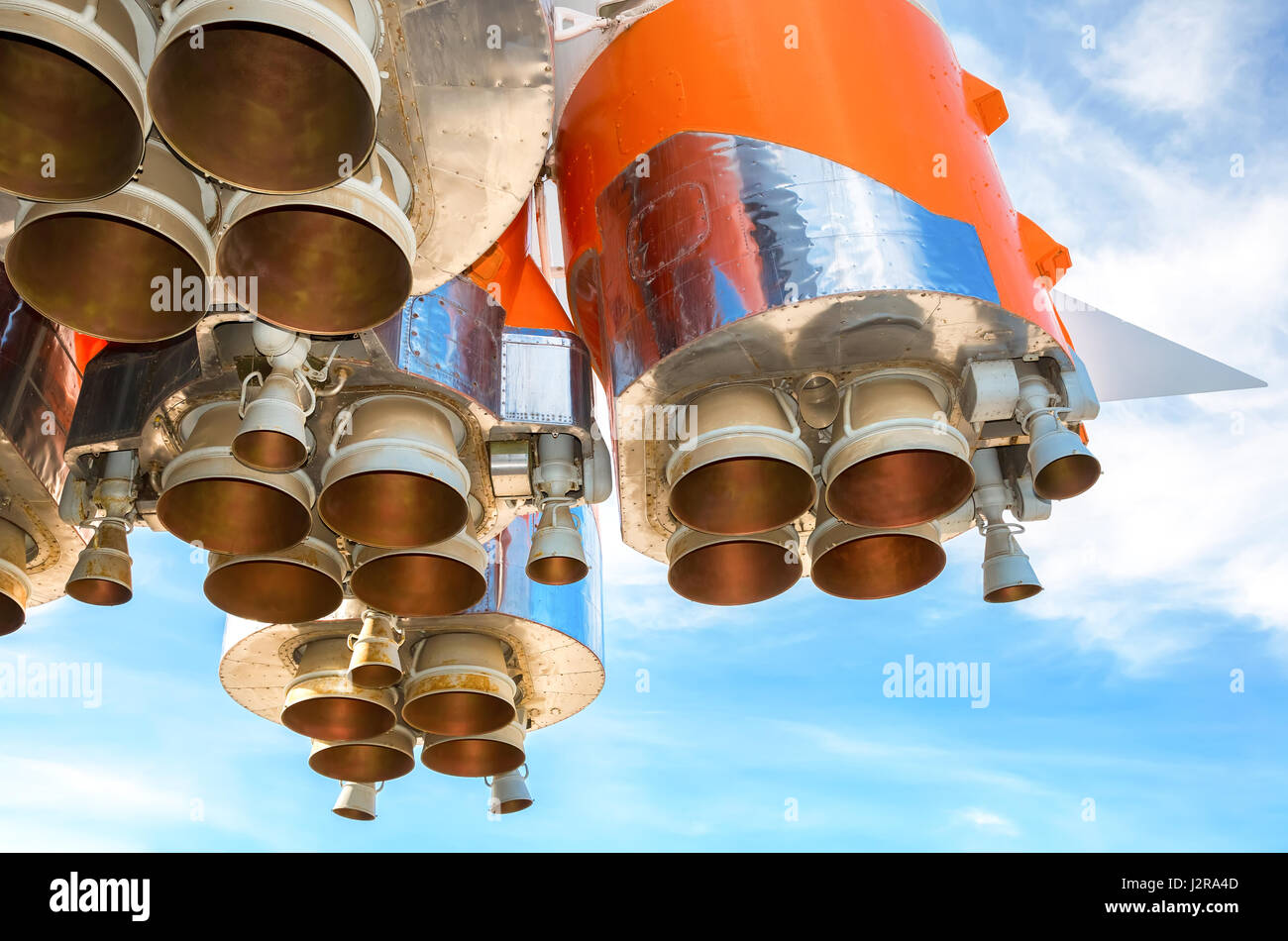 Space rocket engines of the russian spacecraft over blue sky background ...