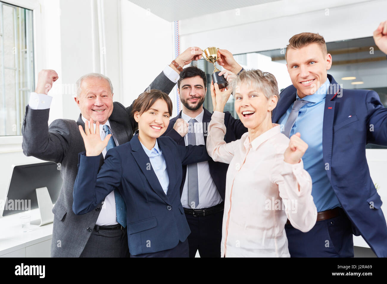Successful business team celebration with start-up throphy Stock Photo ...