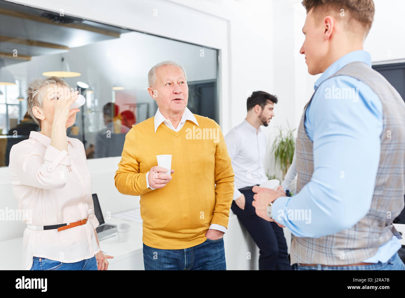Business people in office break talk with colleagues Stock Photo - Alamy