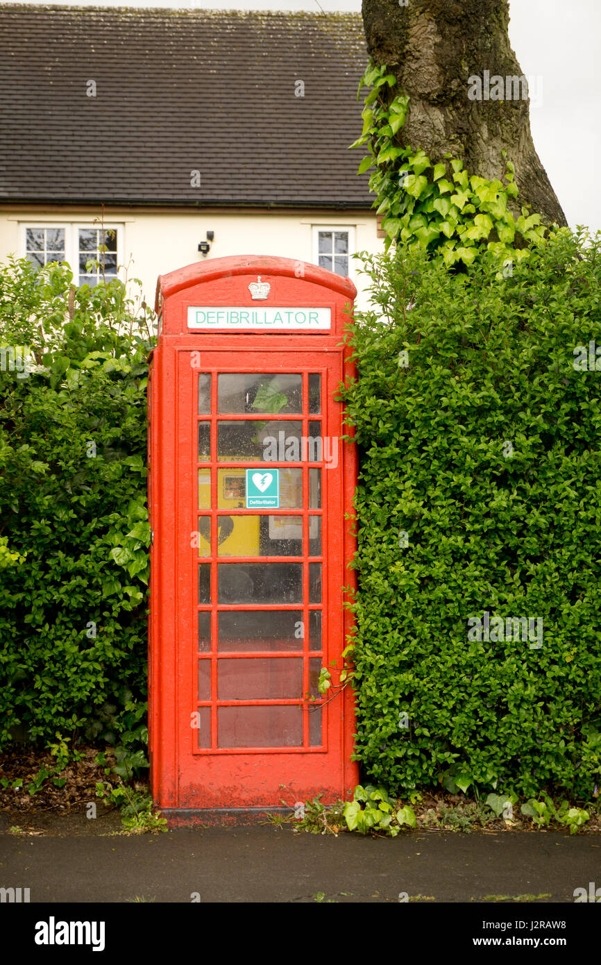 Red phone box containing defibrillator hi-res stock photography and ...