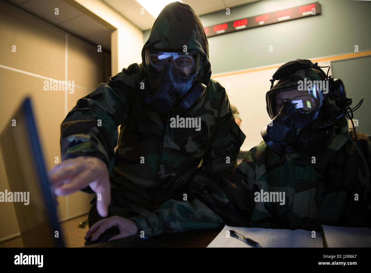 U.S. Marine Corps Staff Sgt. Travis J. Dunlap, left, and Cpl. Laurel ...