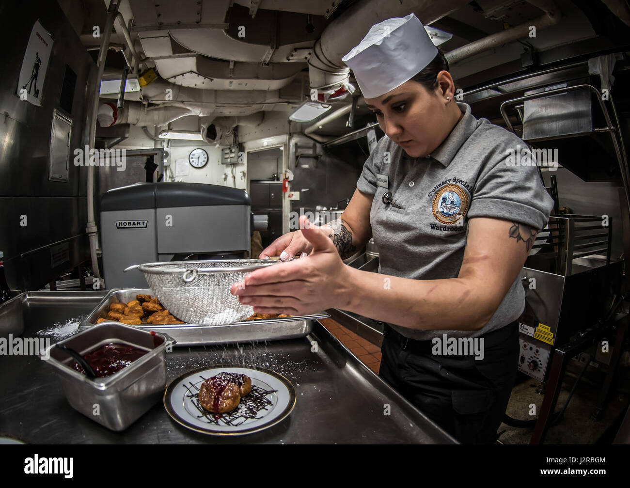 USS Theodore Roosevelt culinary specialists prepare meals in the ...