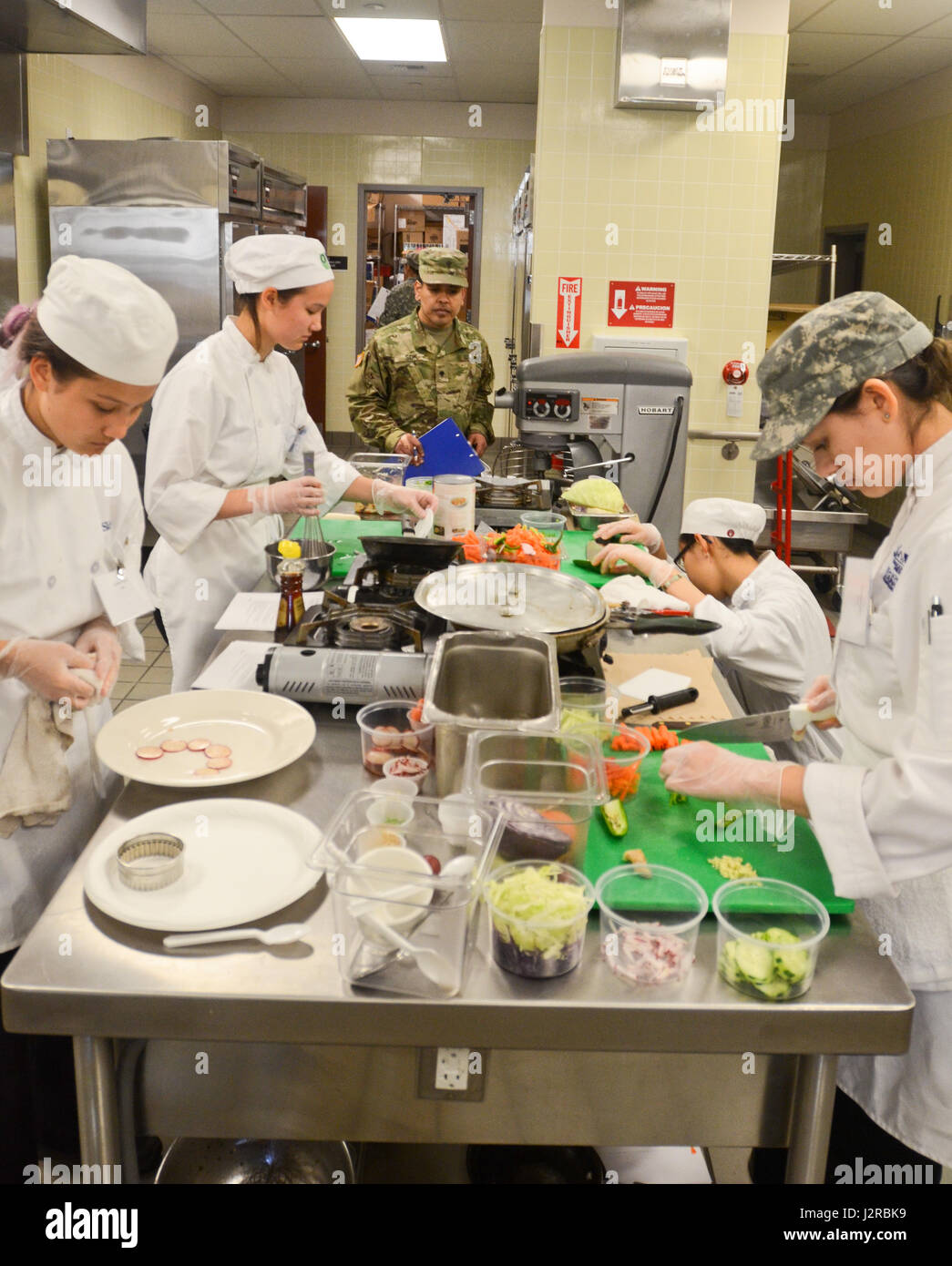 Culinary students prepare meals while Oregon Army National Guard ...