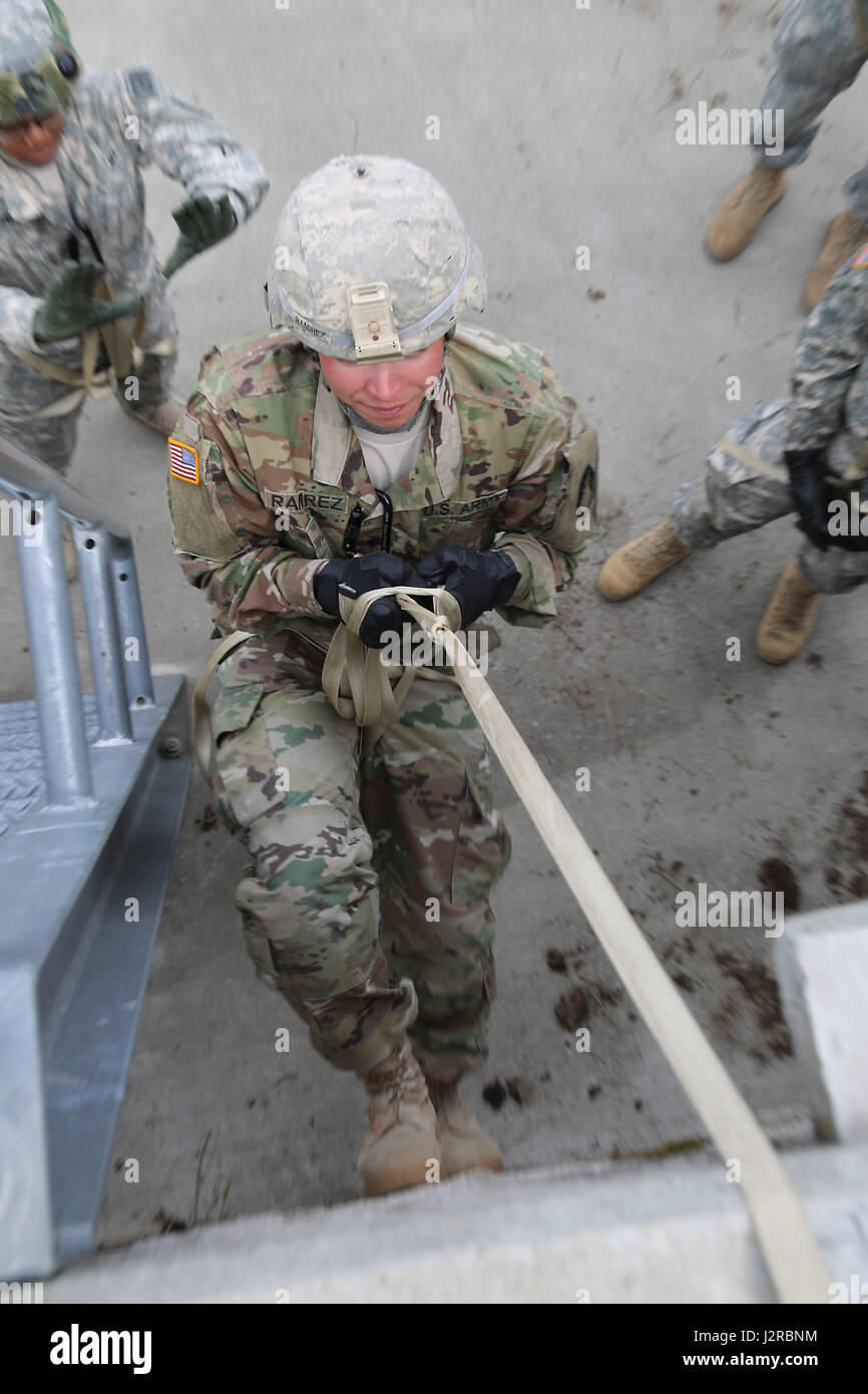 U.S. Army Sgt. Ramirez, 20th CBRNE Command, executes the "up and over ...
