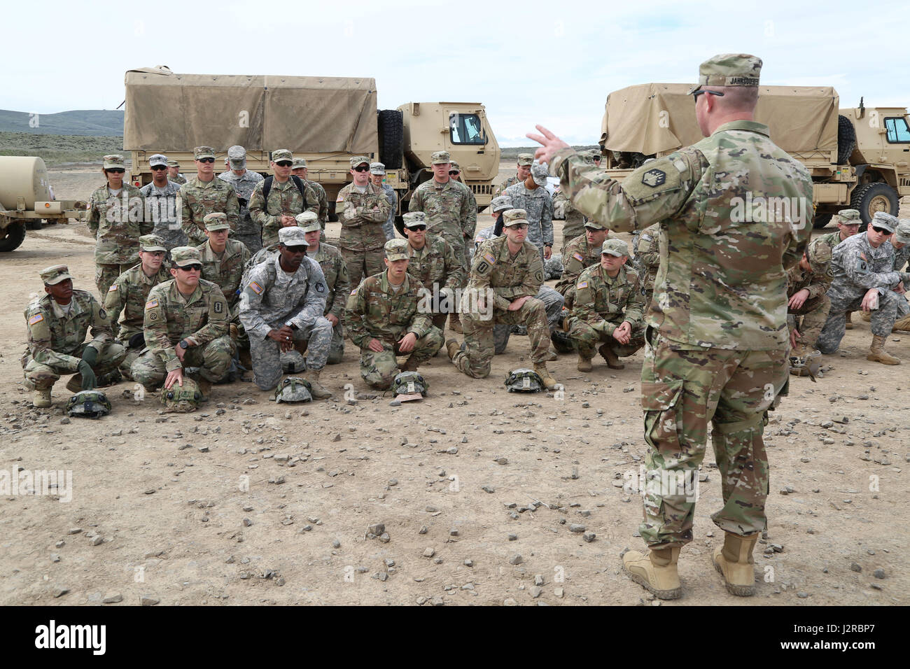 U.S. Soldiers receive instructions before commencing the 9mm pistol ...