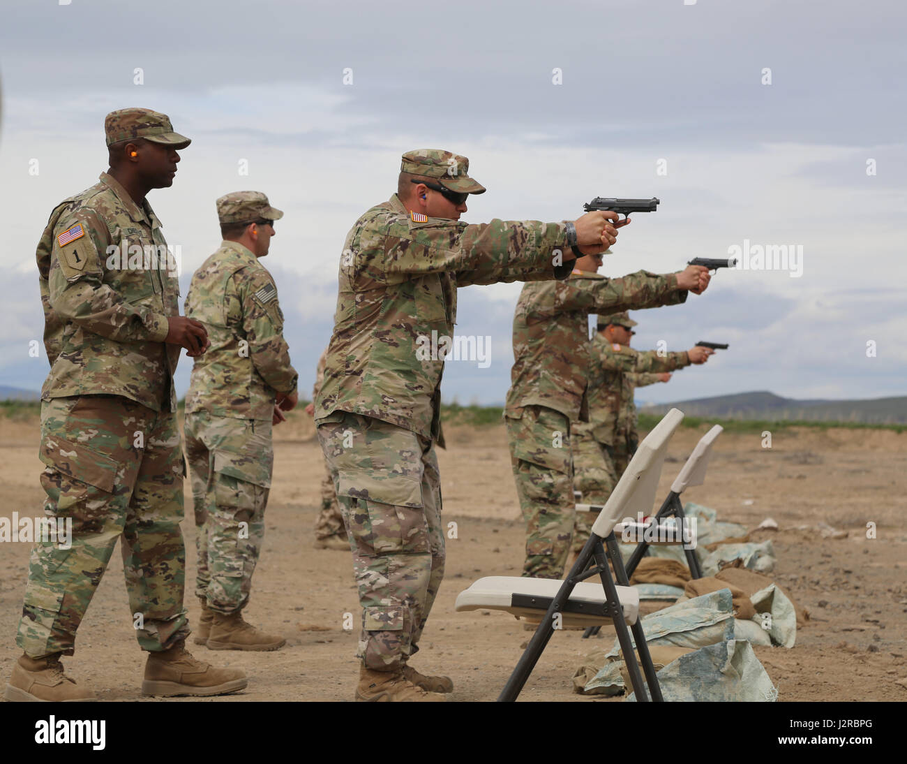 U.S. Soldiers under the 20th CBRNE Command, fire 9mm pistols during the ...