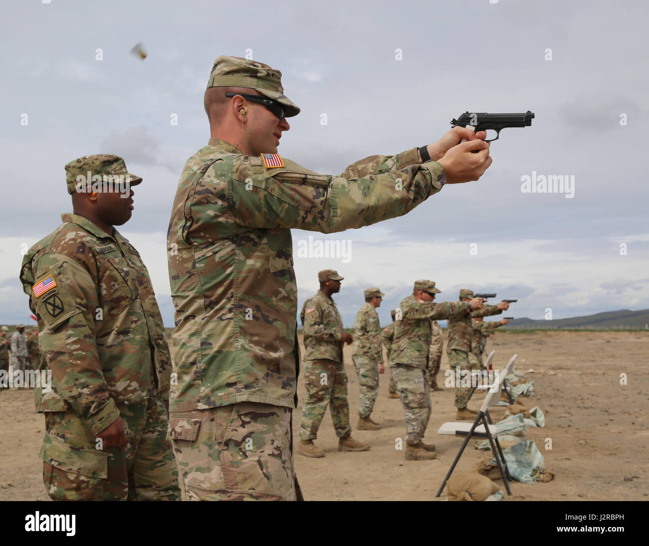 U.S. Soldiers under the 20th CBRNE Command, fire 9mm pistols during the ...