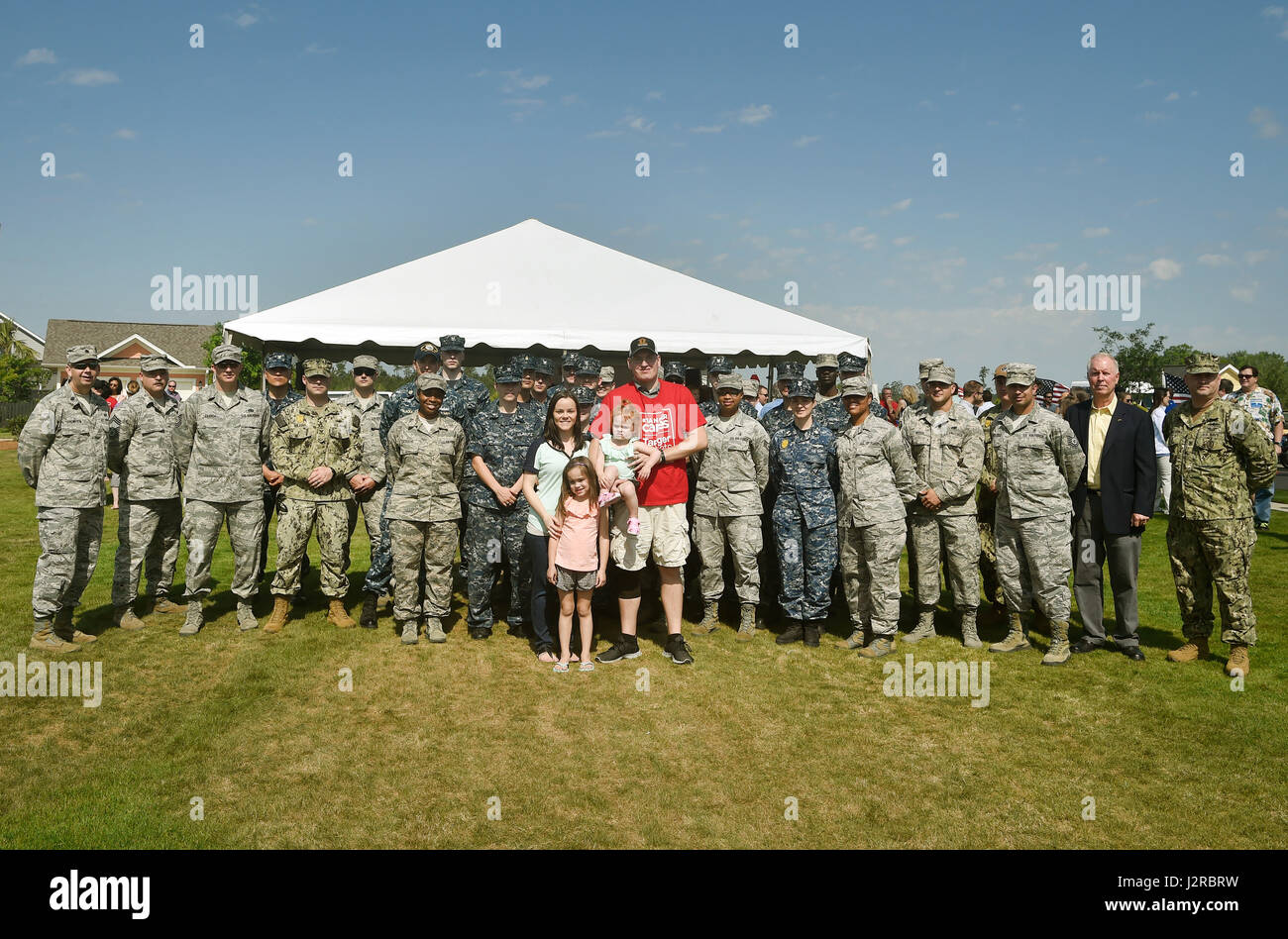 U.S. Marine Corps Lance Cpl. Jeremy Brooking and his family, center ...
