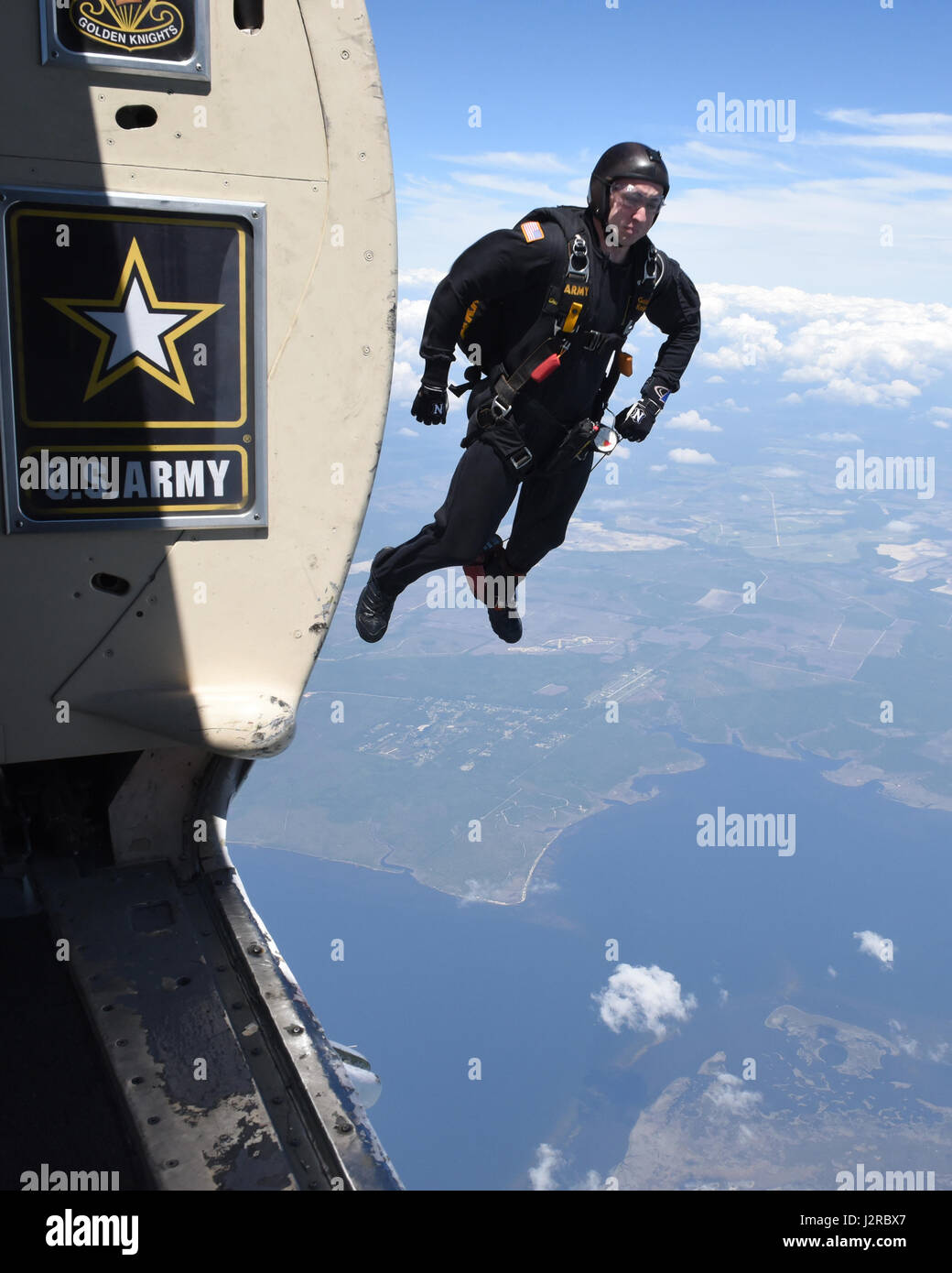 A U.S. Army Golden Knights skydive team member jumps from his plane ...