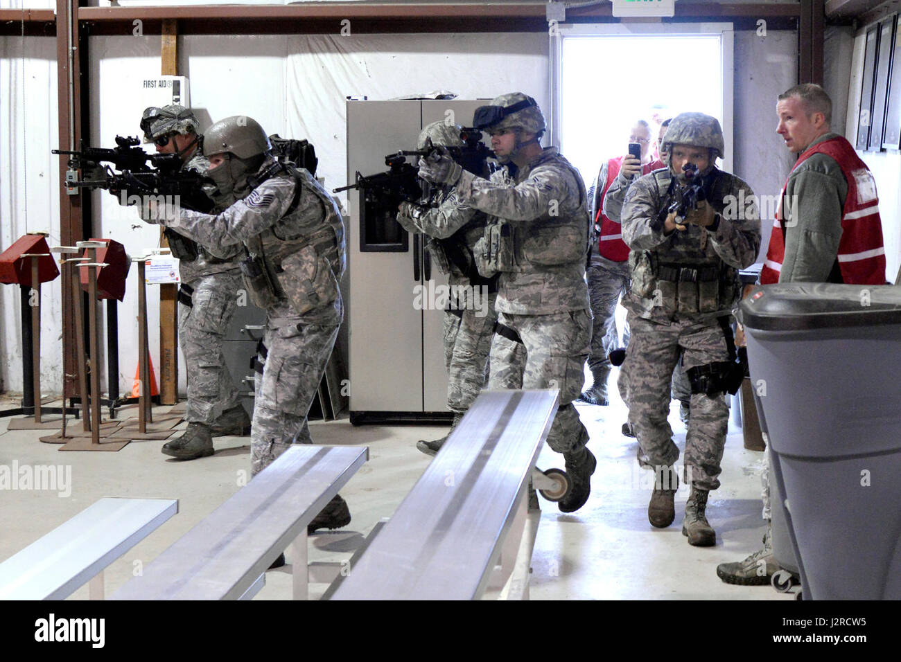 Airmen assigned to the 75th Security Forces Squadron burst into ...