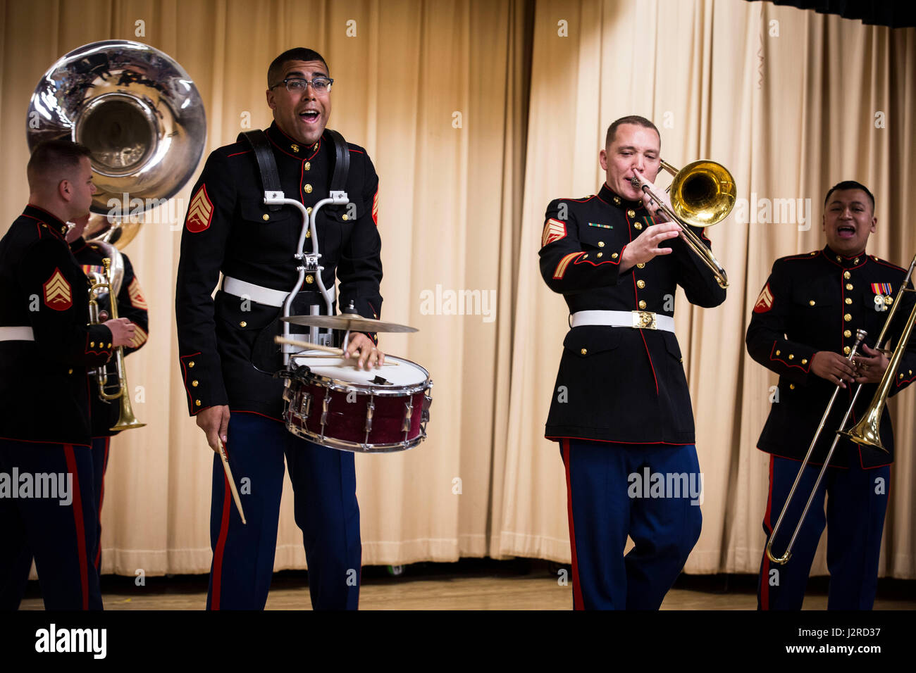 From left, U.S. Marine Corps Sgt. Jordan Snow, enlisted musician ...